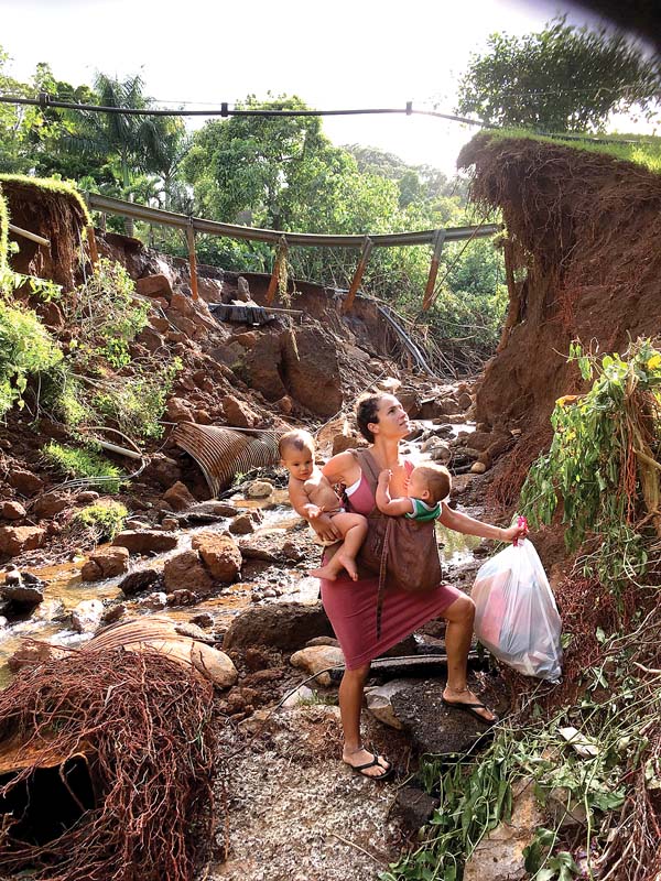 Floodwaters cut 13-foot-deep gully, leaving two Haiku families stranded ...